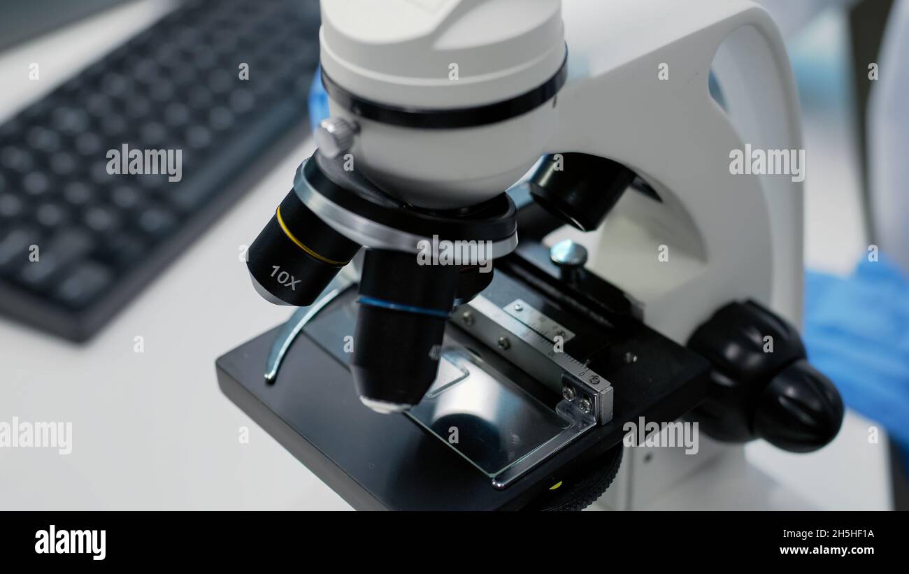 Close up of scientific microscope sample tray in laboratory used by ...