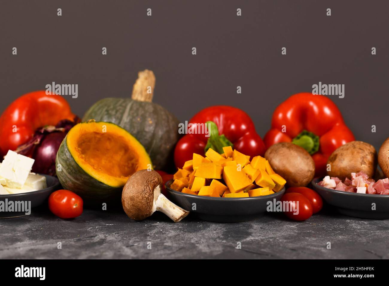 Kabicha pumpkin meal ingredients with, mushrooms, bell pepper, tomatoes ...