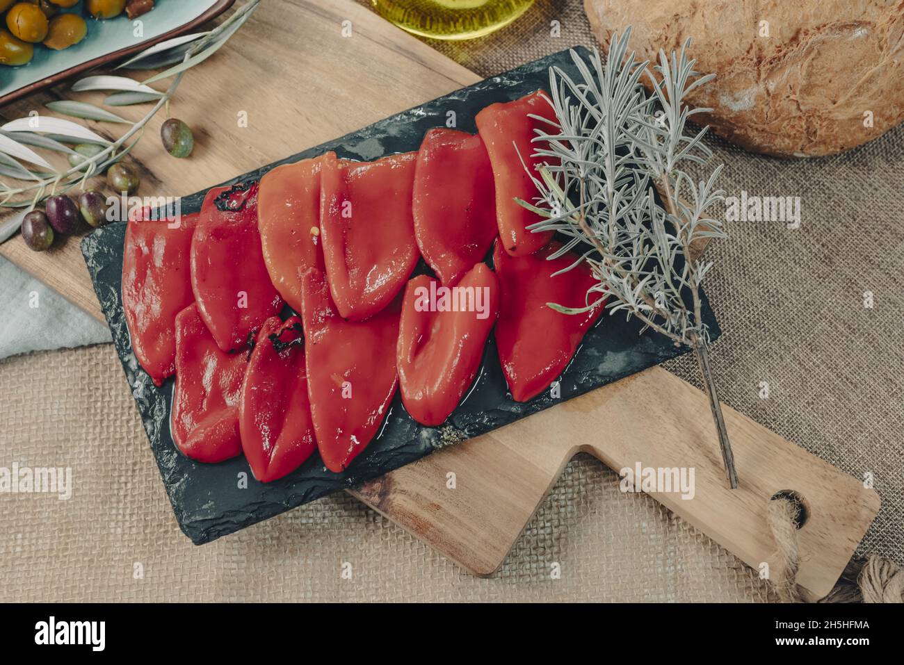 Tray of wood-roasted peppers. Typical rustic setting Stock Photo - Alamy