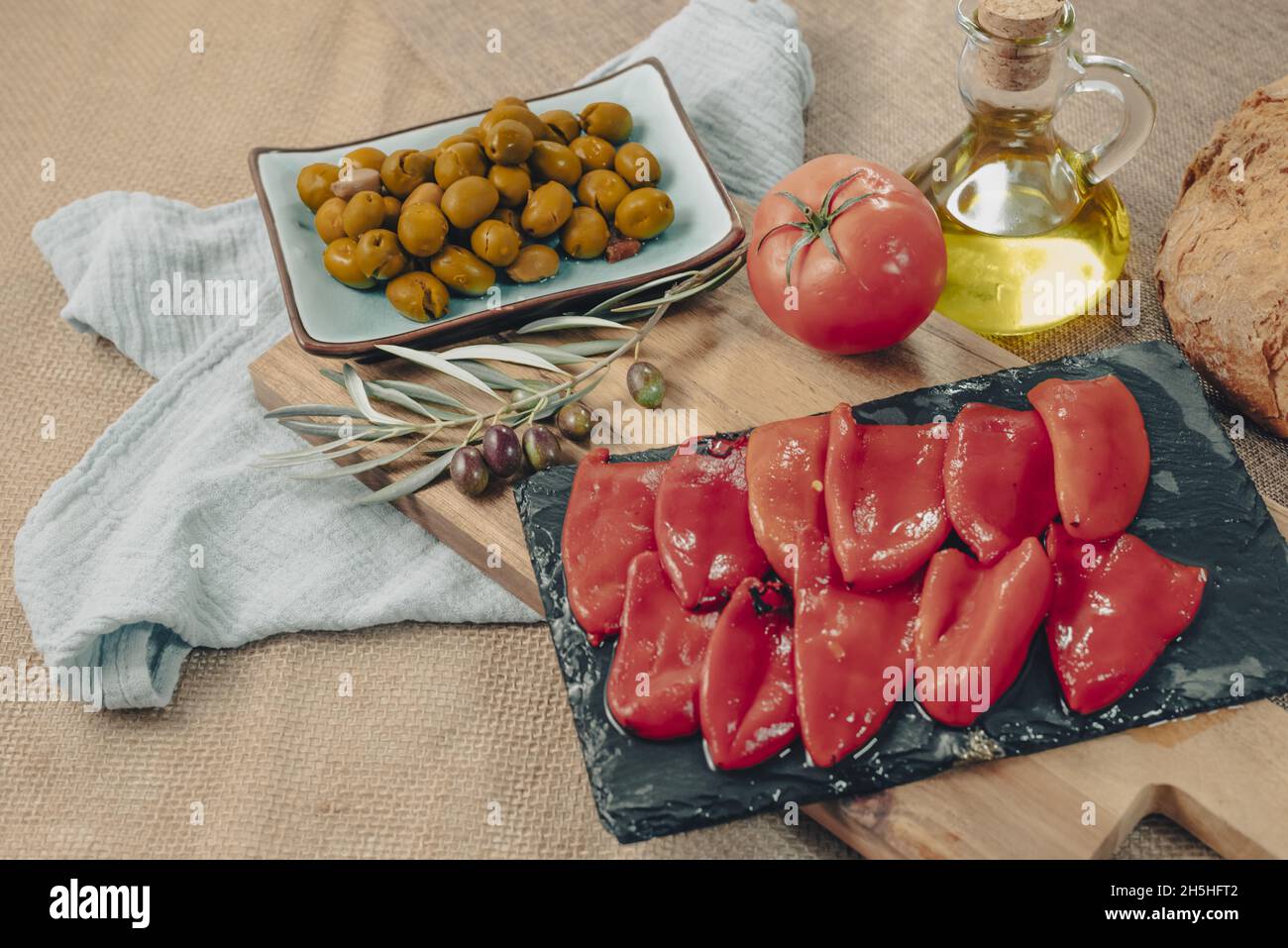 Tray of wood-roasted peppers. Typical rustic setting Stock Photo - Alamy