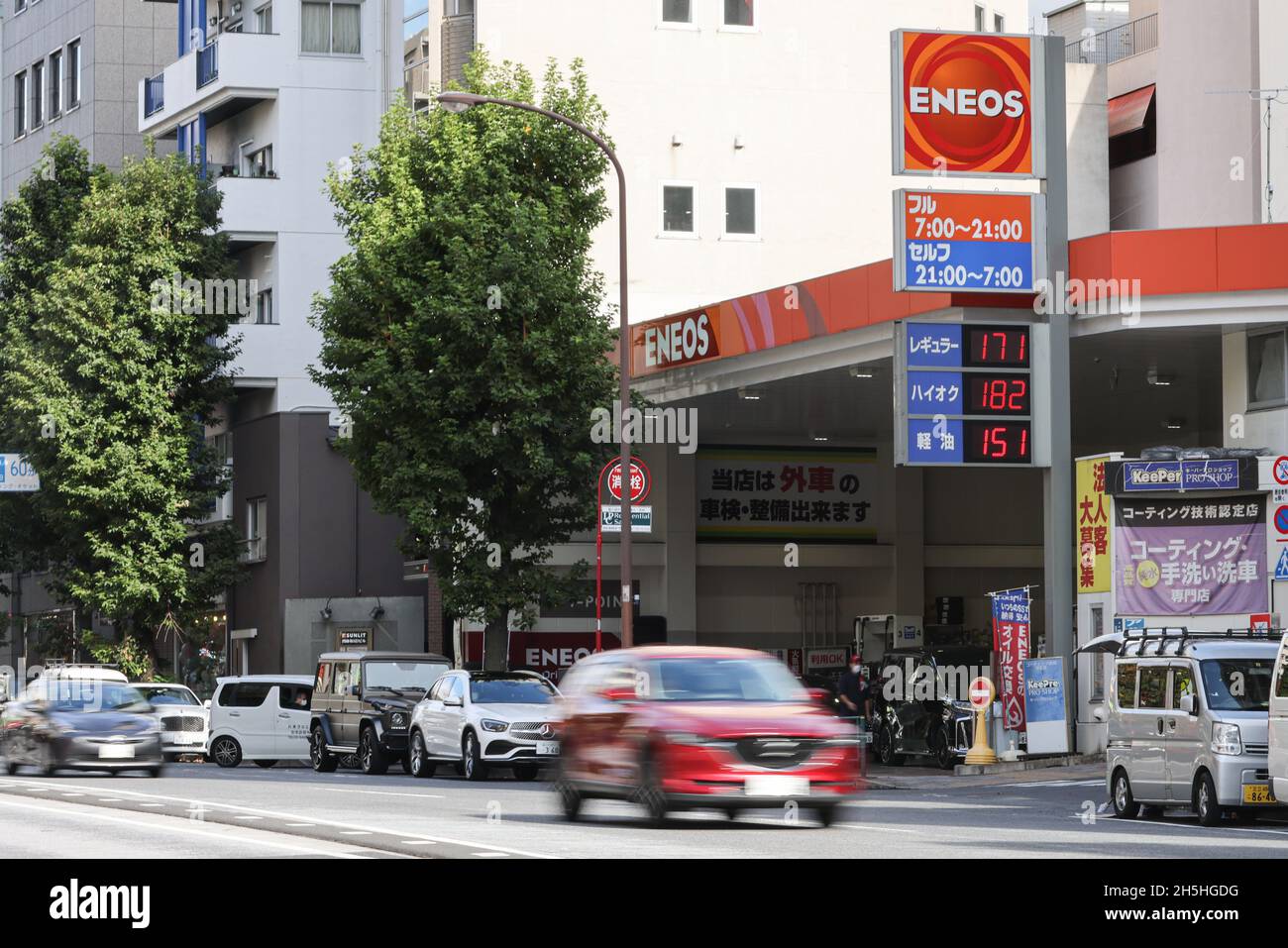 The prices of petrol and diesel are displayed on a signboard at a gas ...