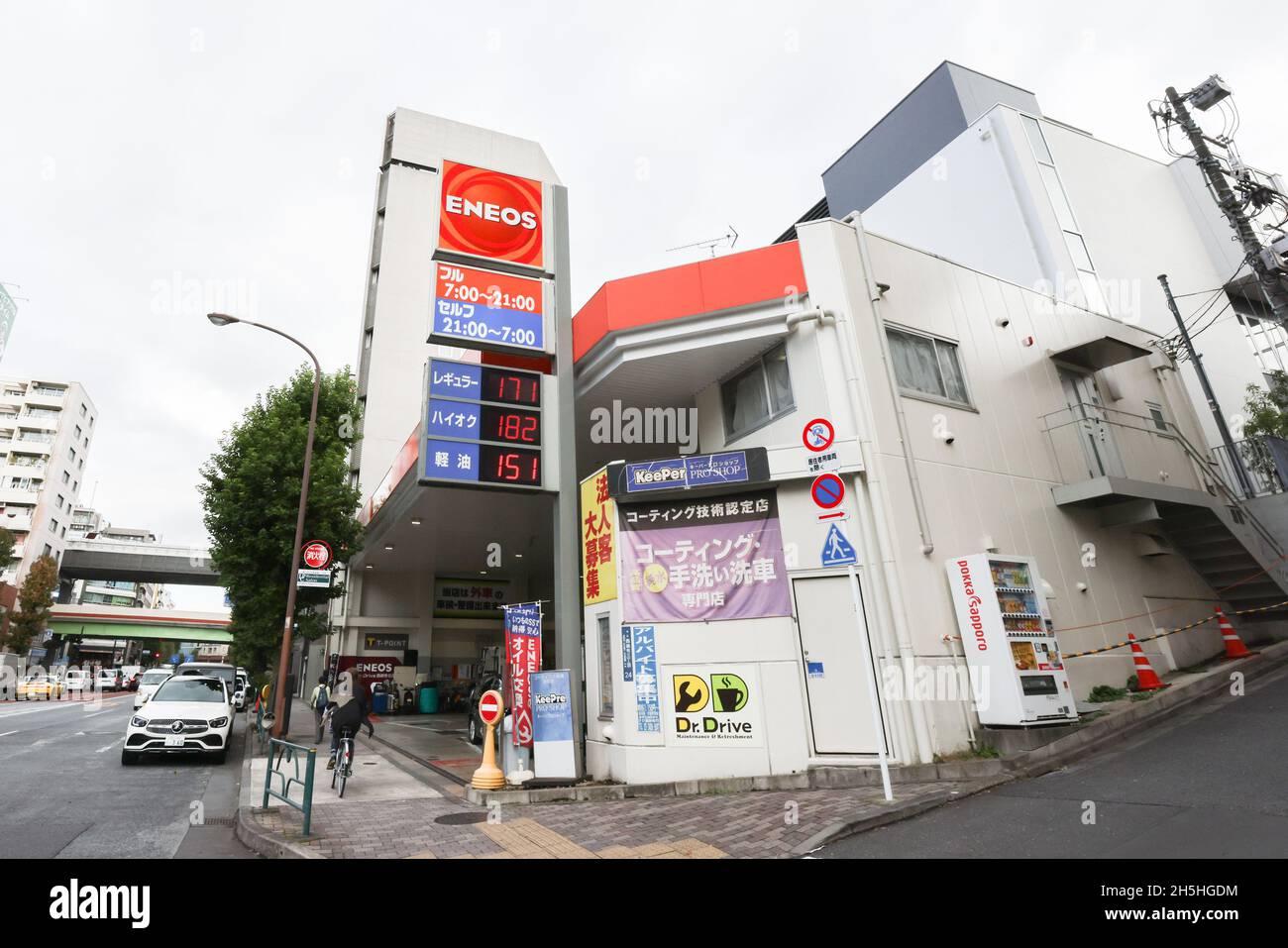 The prices of petrol and diesel are displayed on a signboard at a gas ...