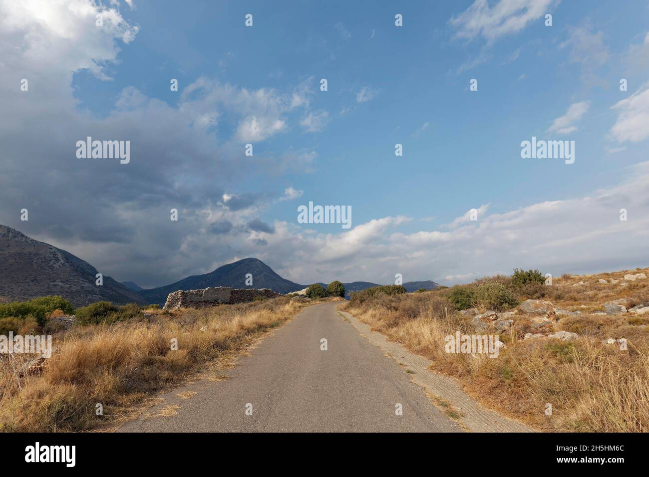 Lonely road in the Taygetos Mountains, ruins of the Ottoman castle ...