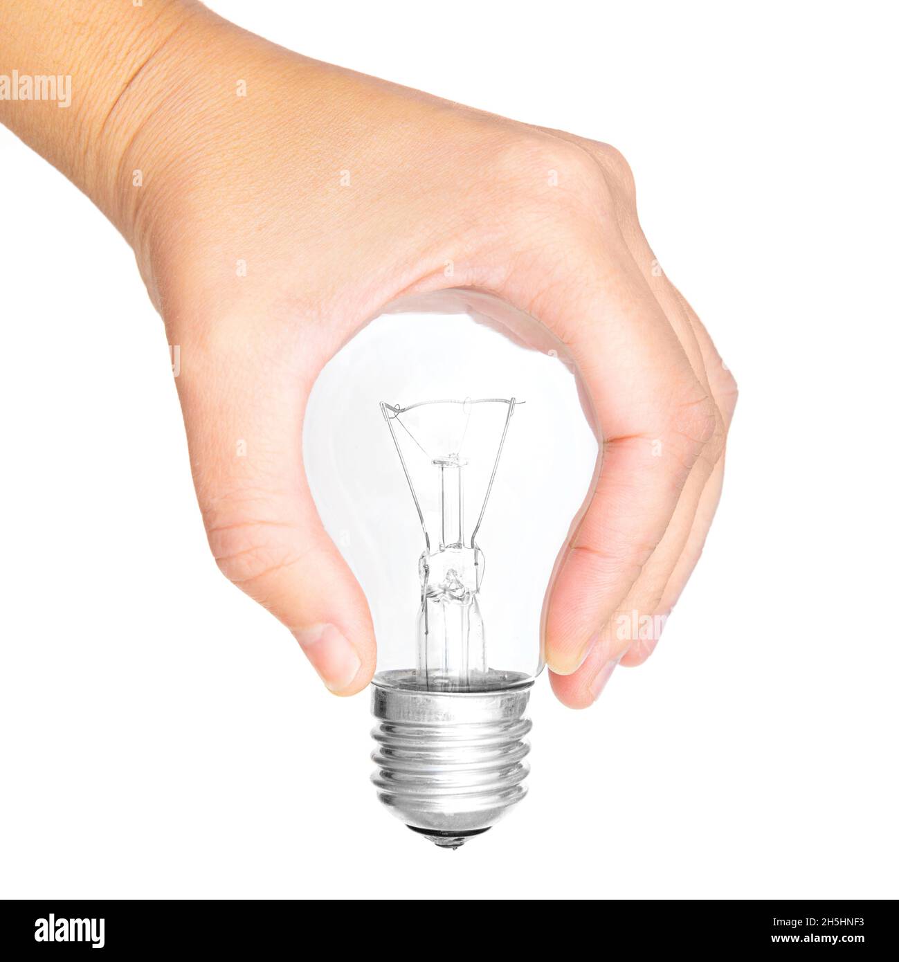 Incandescent light bulb in hand isolated on white background Stock ...