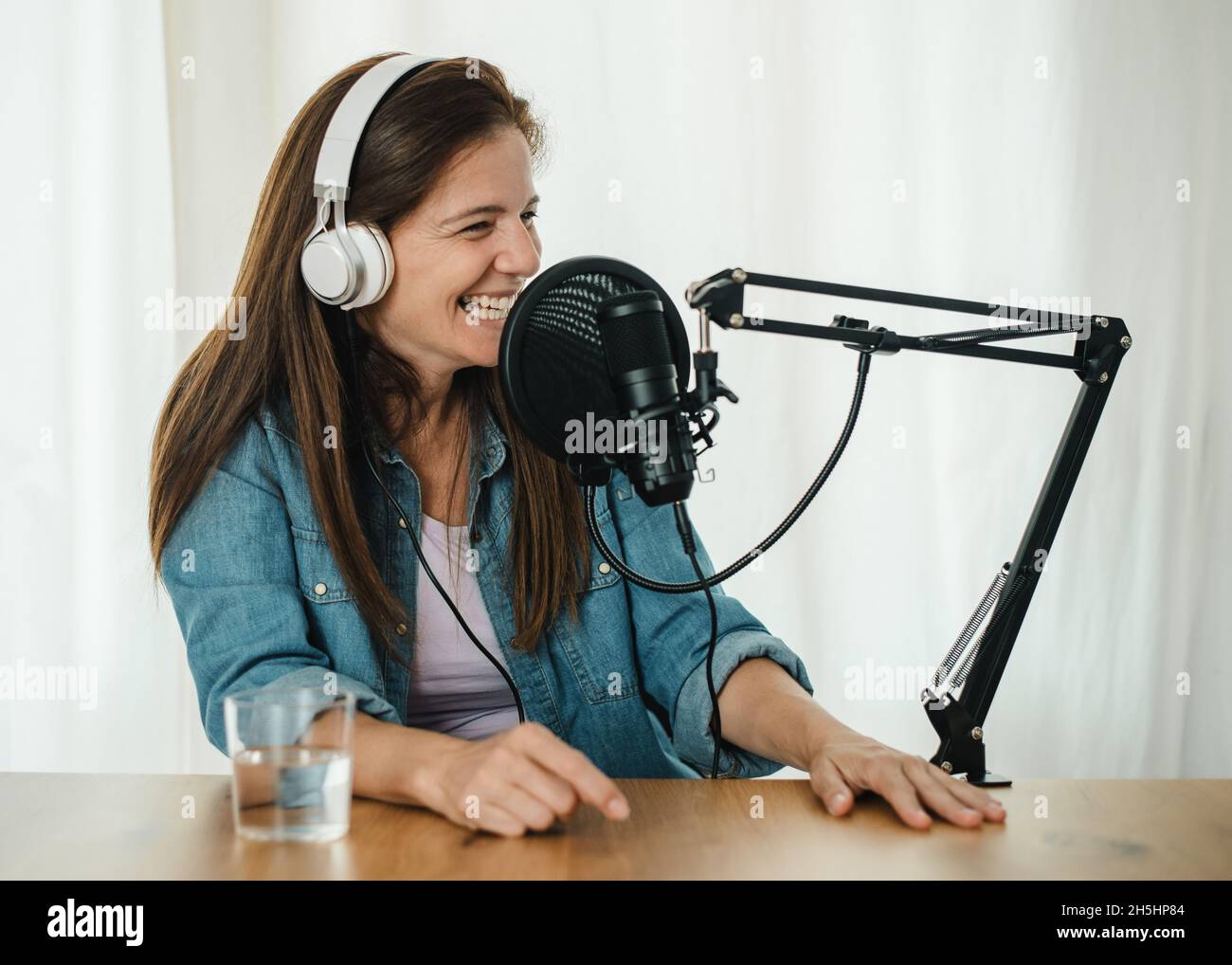 Happy woman recording audio hi-res stock photography and images - Alamy