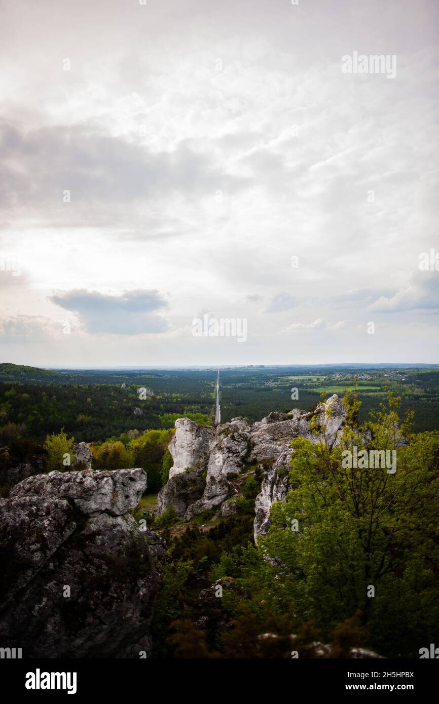 Stunning landscape with rock cliffs and distant forest with road ...
