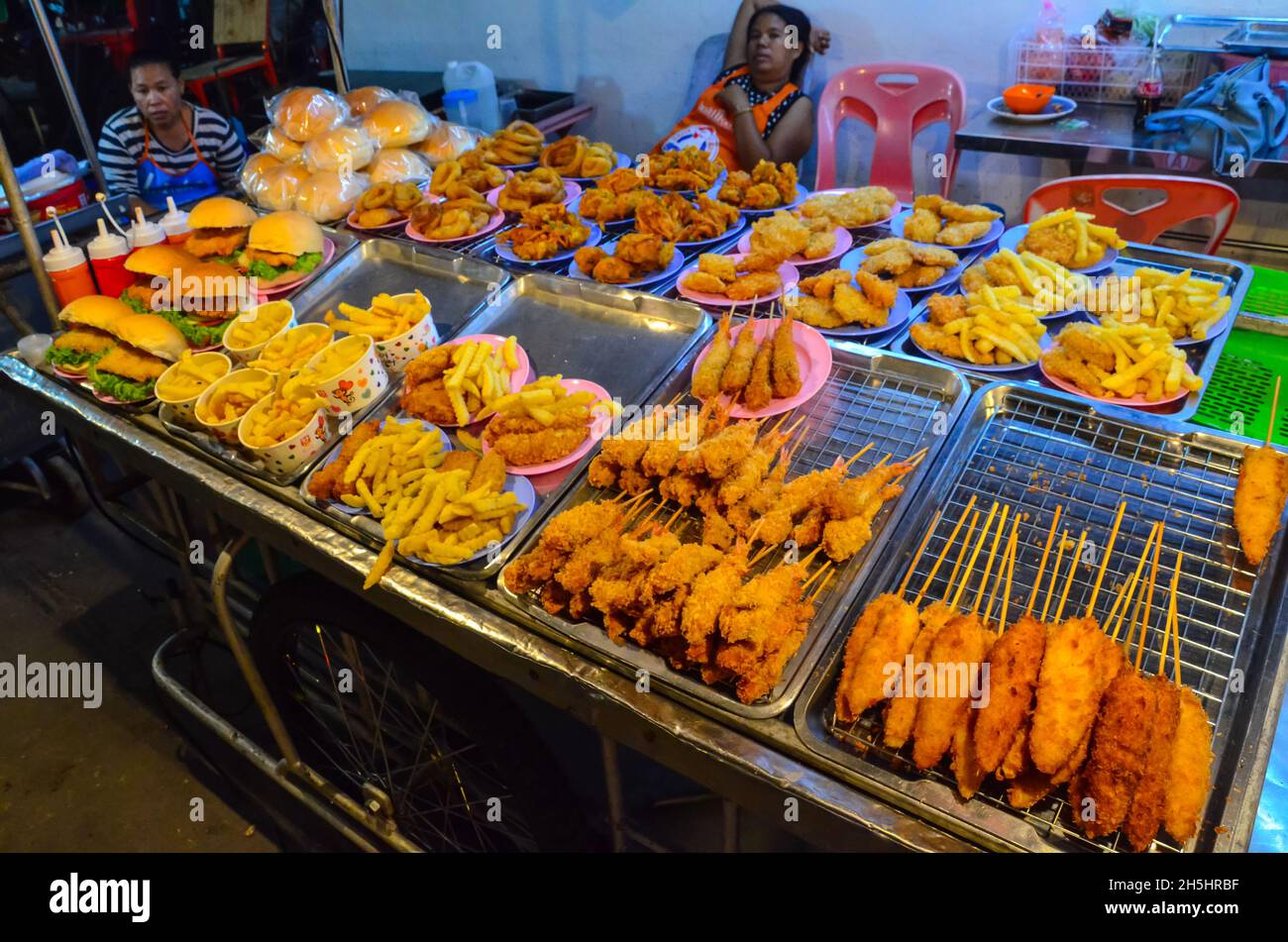 Outdoors market selling junk food in Thailand Stock Photo - Alamy