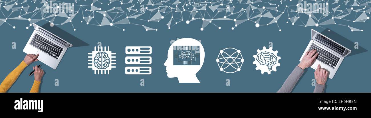 Top view of hands using laptop with symbol of machine learning concept ...