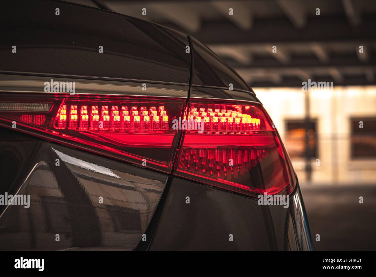 Rear lights from a luxury sedan Stock Photo - Alamy