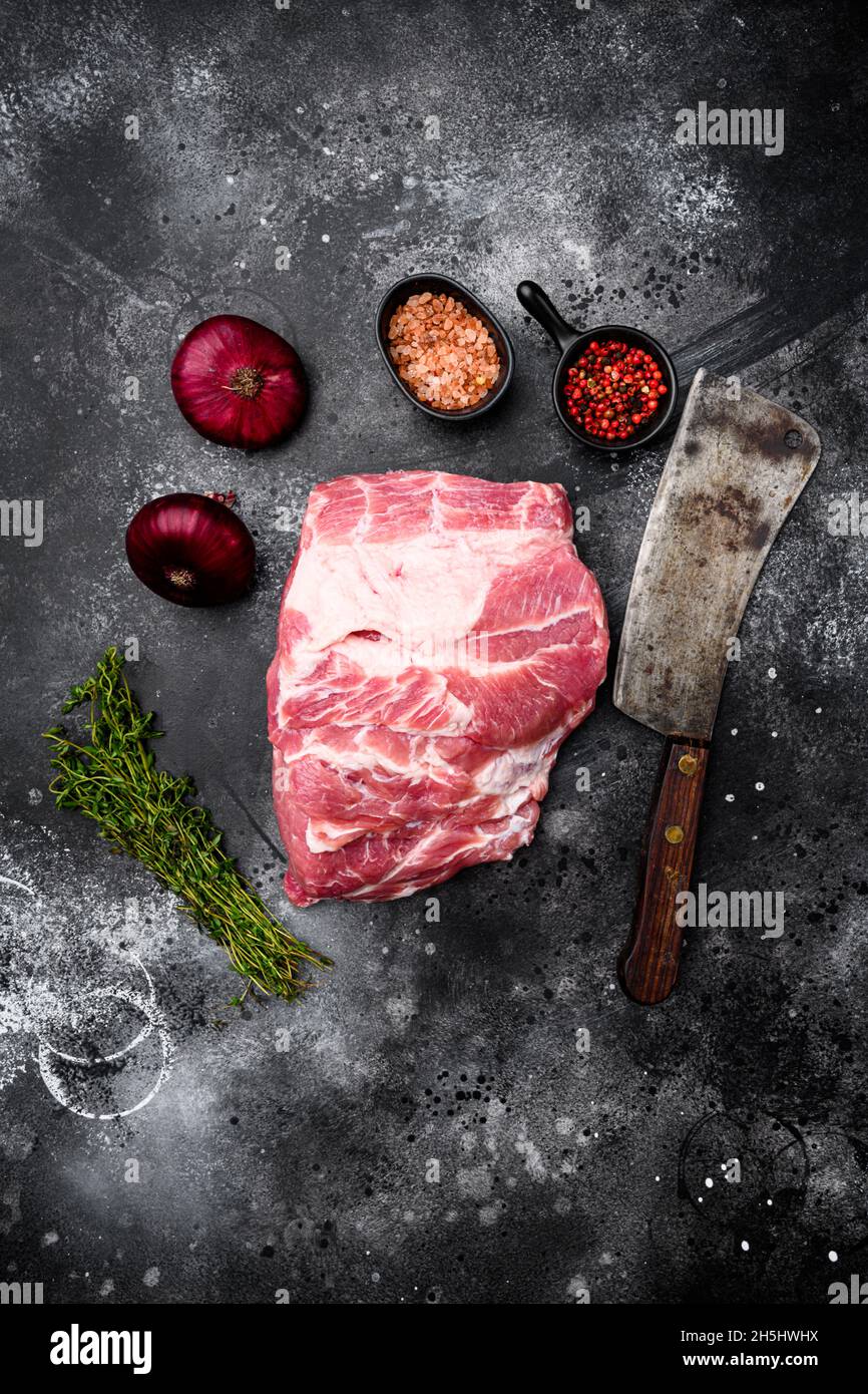 Raw meat set, with ingredients and herbs , with old butcher cleaver ...