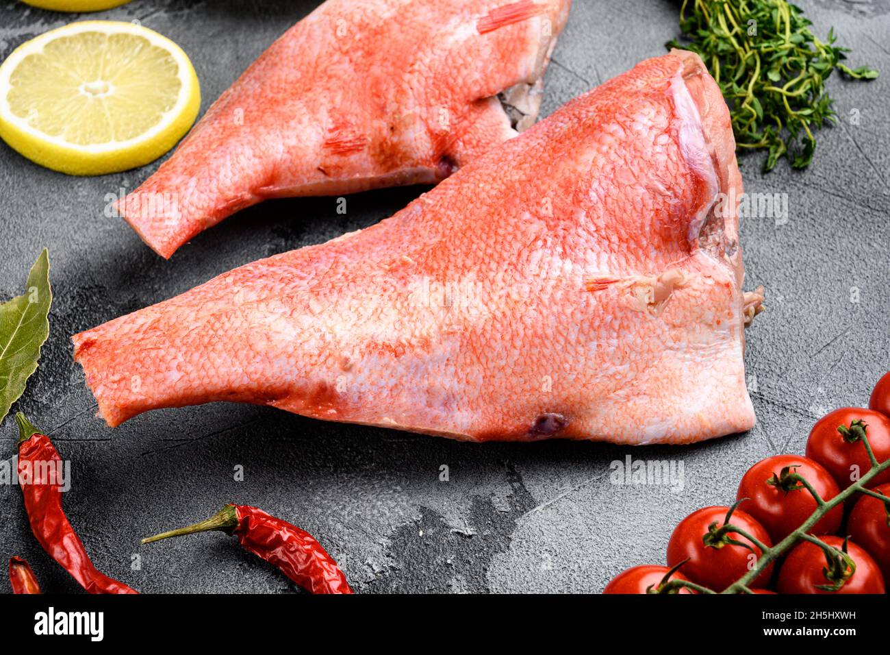 Fresh red perch or sea bass set, on gray stone table background Stock ...