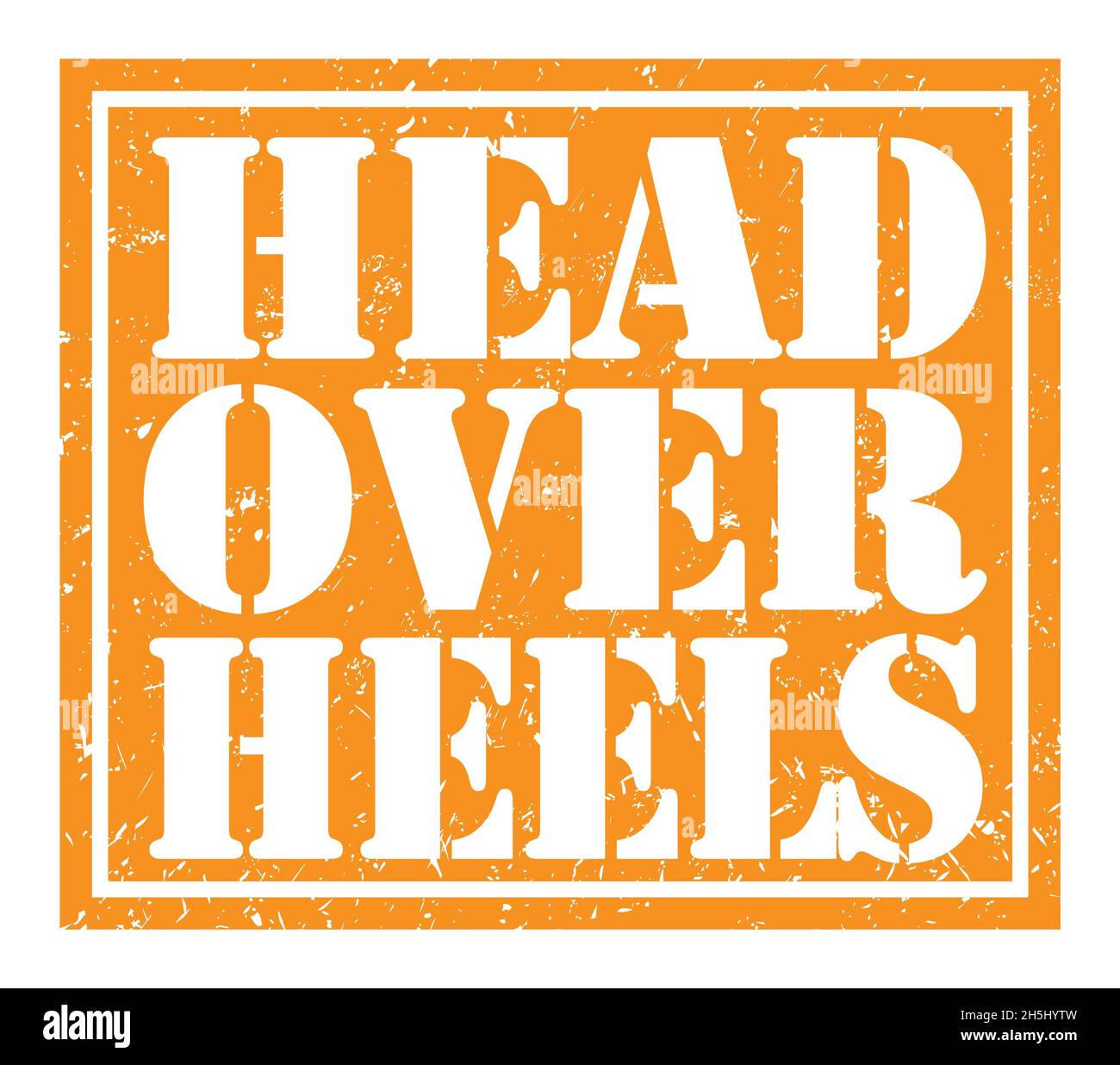 HEAD OVER HEELS, words written on orange stamp sign Stock Photo - Alamy
