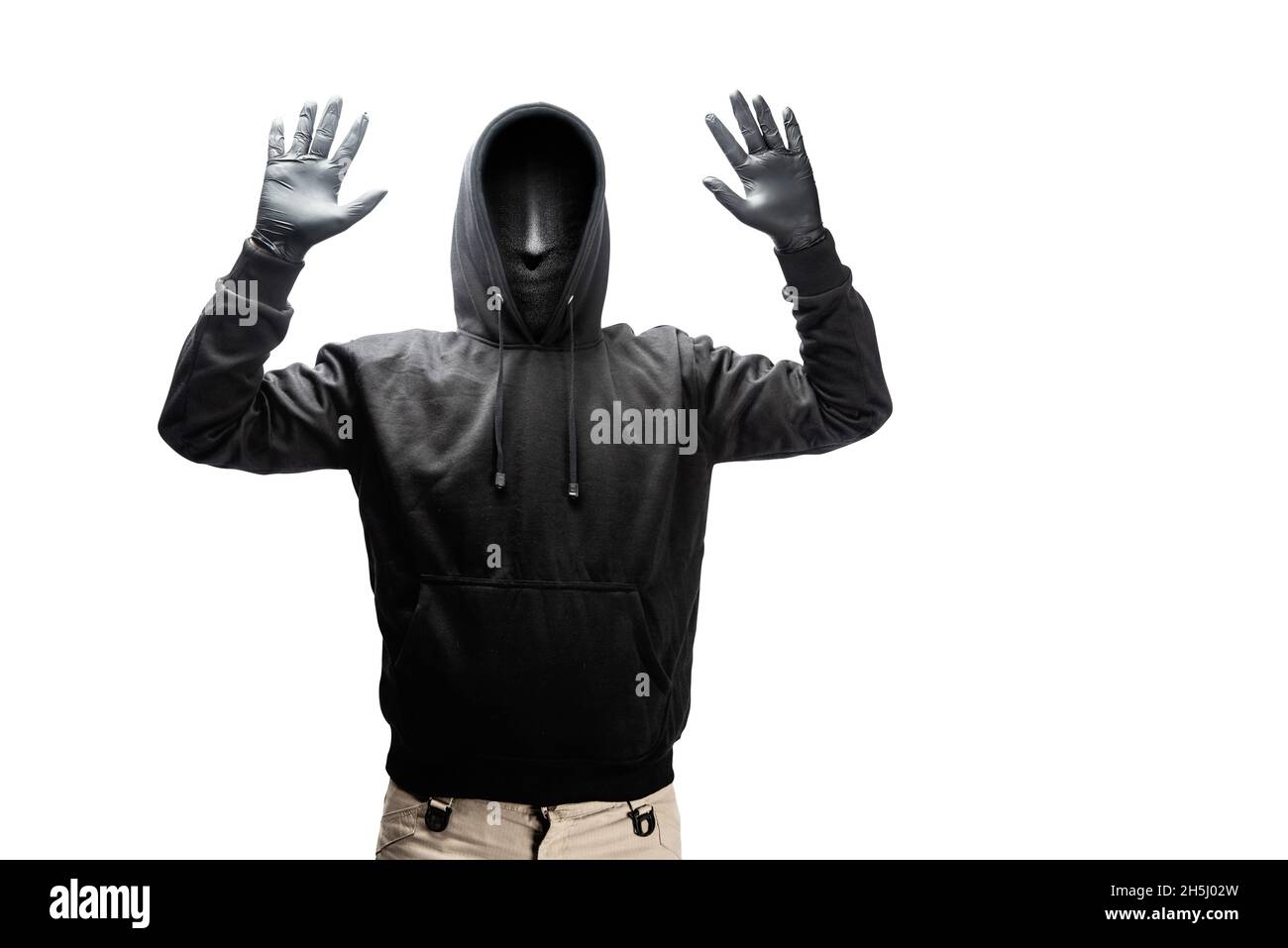 A criminal man in a hidden mask raised a hand for arrested isolated ...