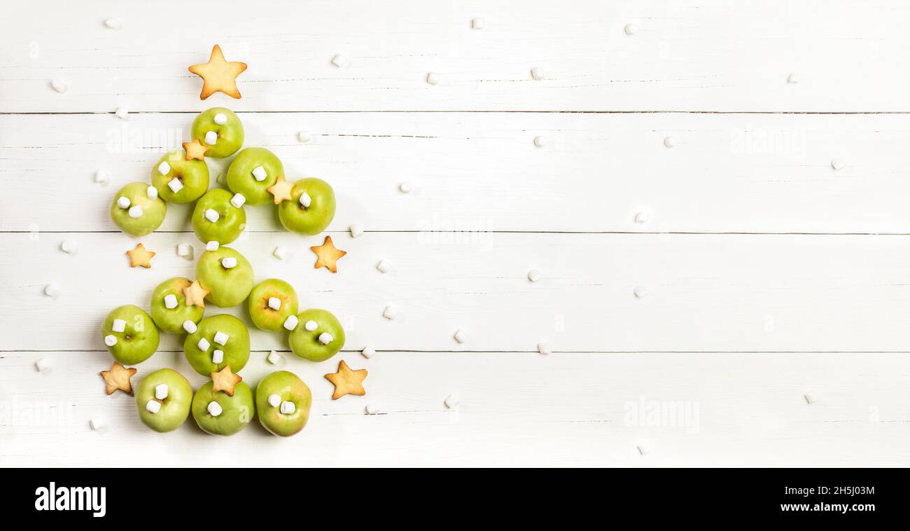Edible Christmas tree of green apples decorated with star shape ...