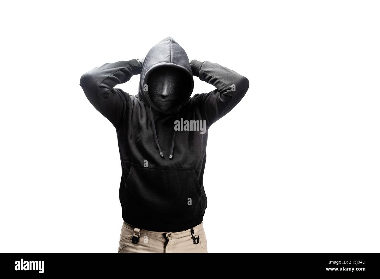 A criminal man in a hidden mask raised a hand behind the head for ...