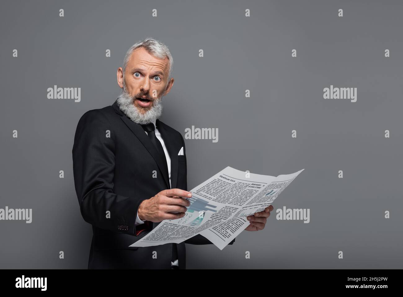 Newspaper hold man suit hi-res stock photography and images - Alamy