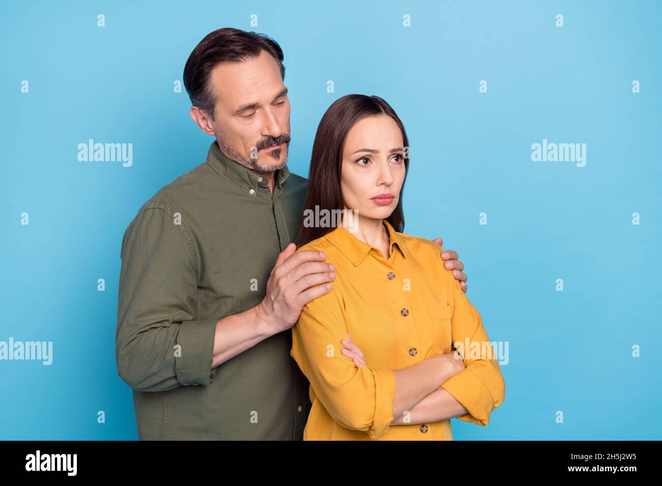 Portrait of two persons lady folded hands man touch shoulders calming ...