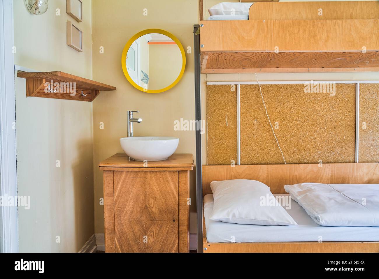 Cosy and quiet room with bunk beds and walls covered with warm colours ...