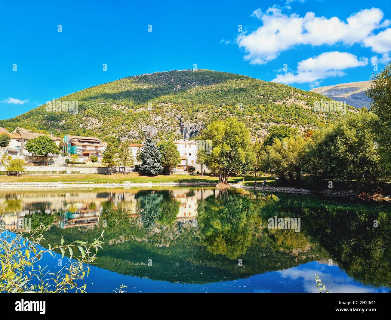 Town of Villalago reflected in the lake in Abruzzo, Italy Stock Photo ...