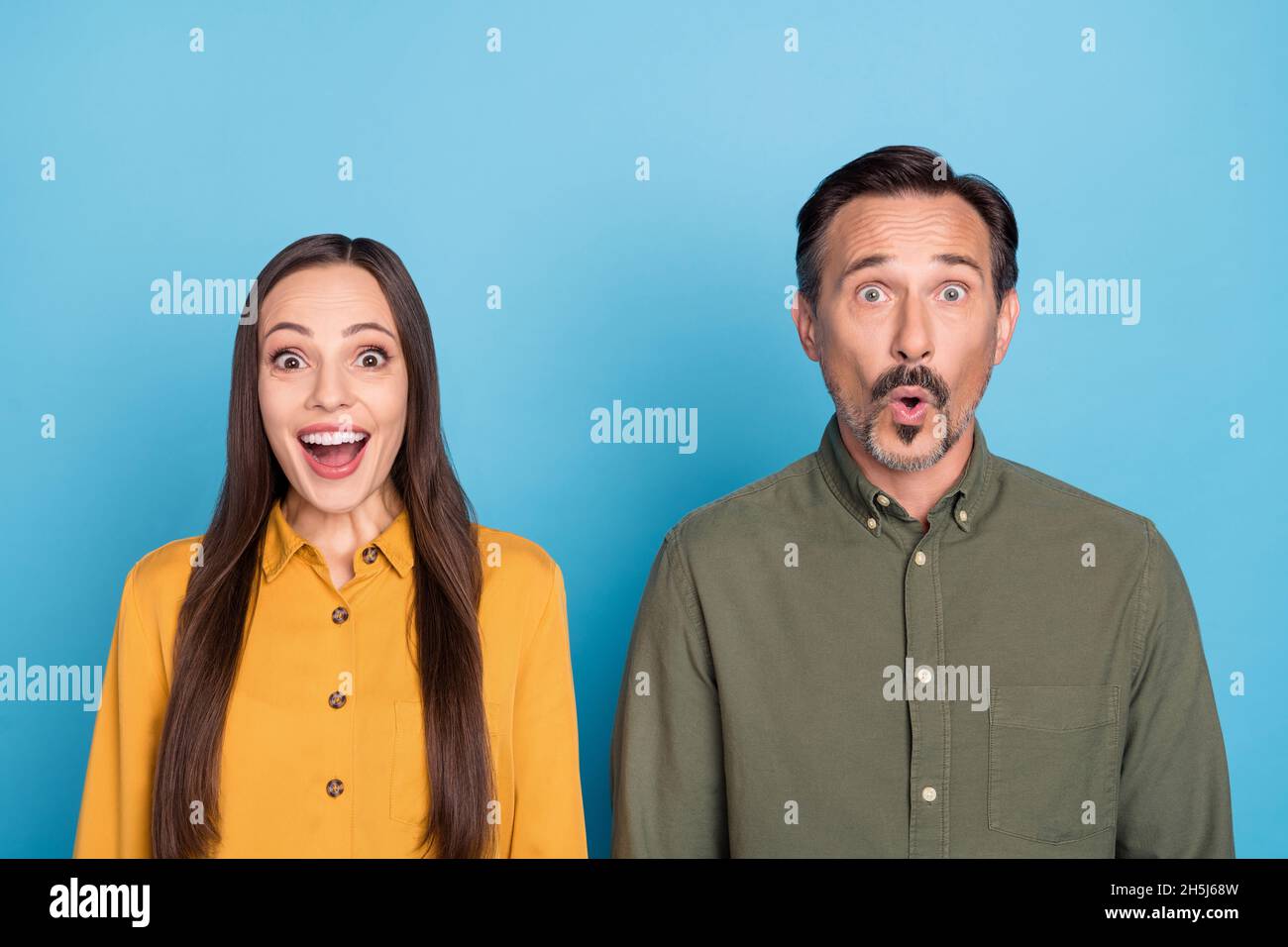 Photo of astonished lady impressed man open mouth unbelievable look ...