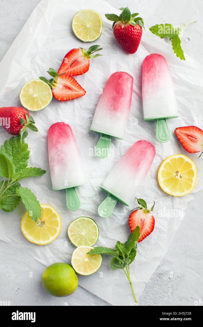 Strawberry water ice on fruit background Stock Photo - Alamy