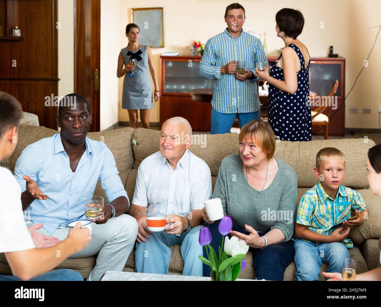 Family blithely talking Stock Photo - Alamy