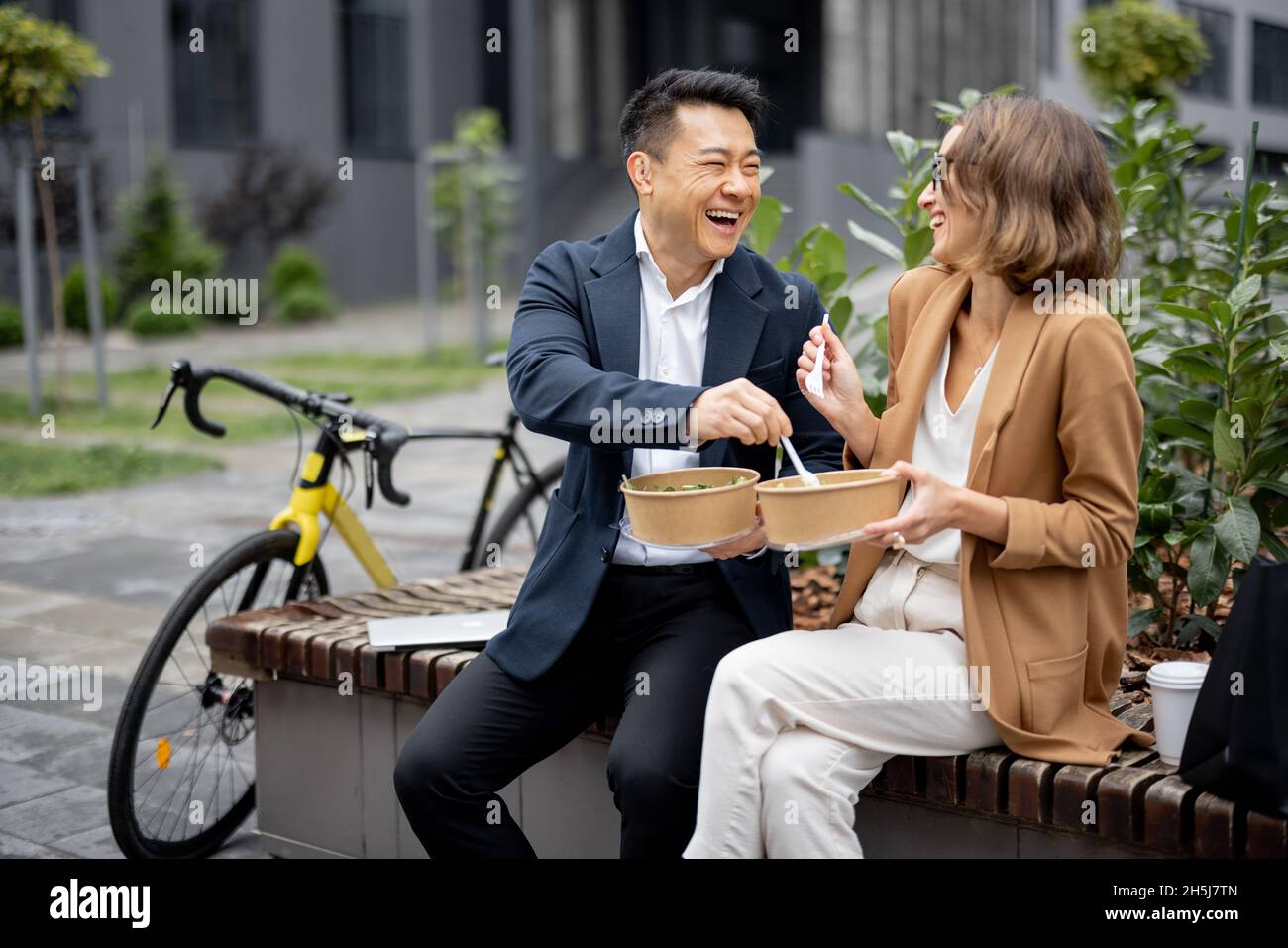 Business people having lunch at work in city Stock Photo - Alamy