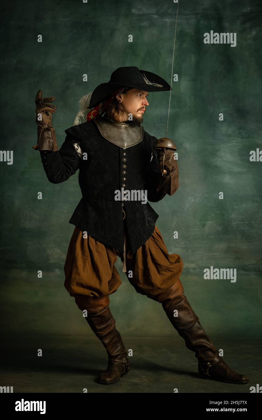 Portrait of brutal horrendous man, medeival pirate in vintage costume ...