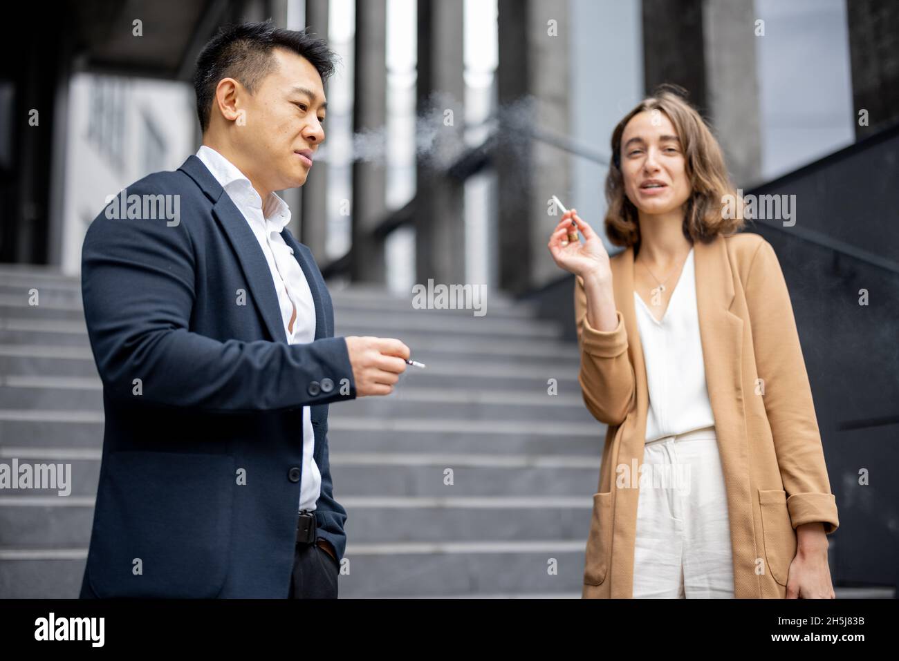 People smoking cigarettes during break at work Stock Photo - Alamy