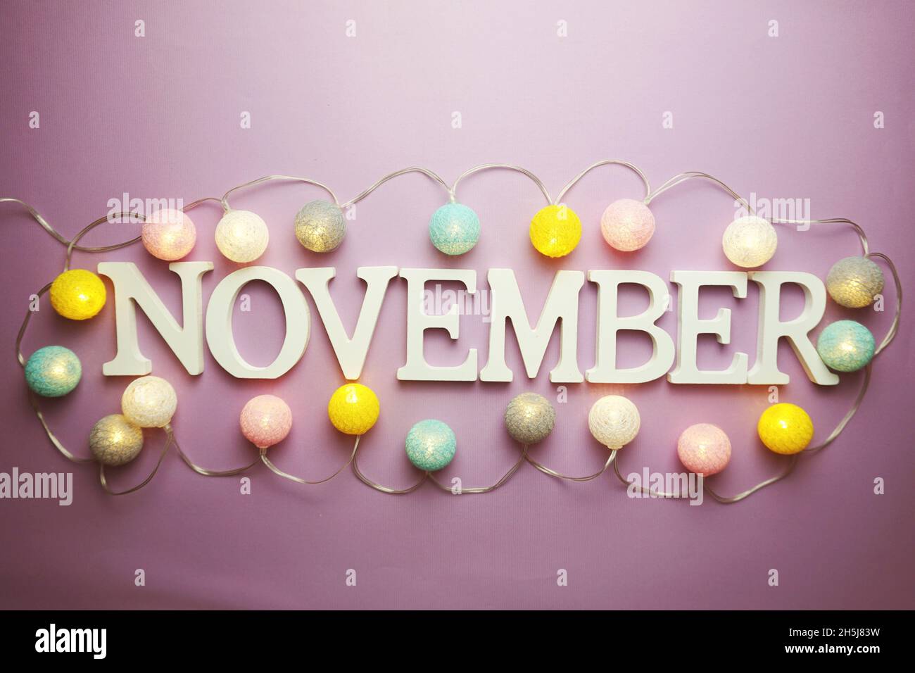 November alphabet letter with cotton ball LED decoration on purple ...