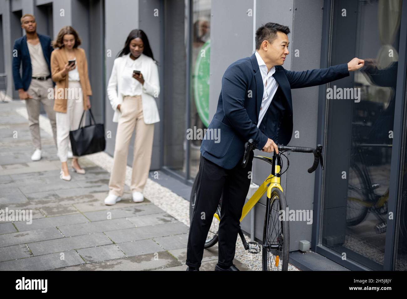 Multiracial businesspeople waiting in queue on city street Stock Photo ...