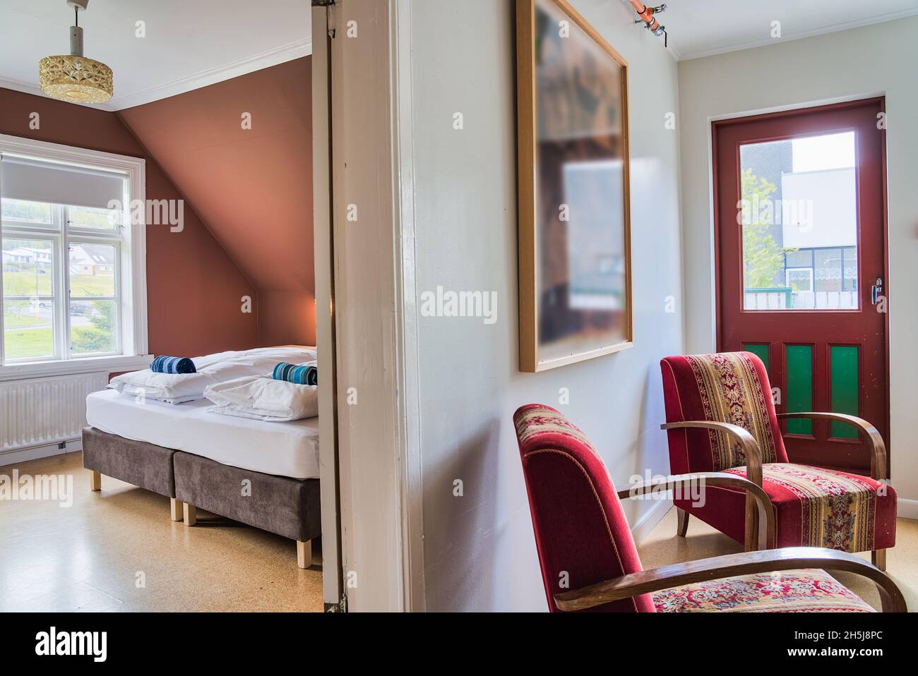 Cosy and quiet room with walls covered with warm colours and ecological ...