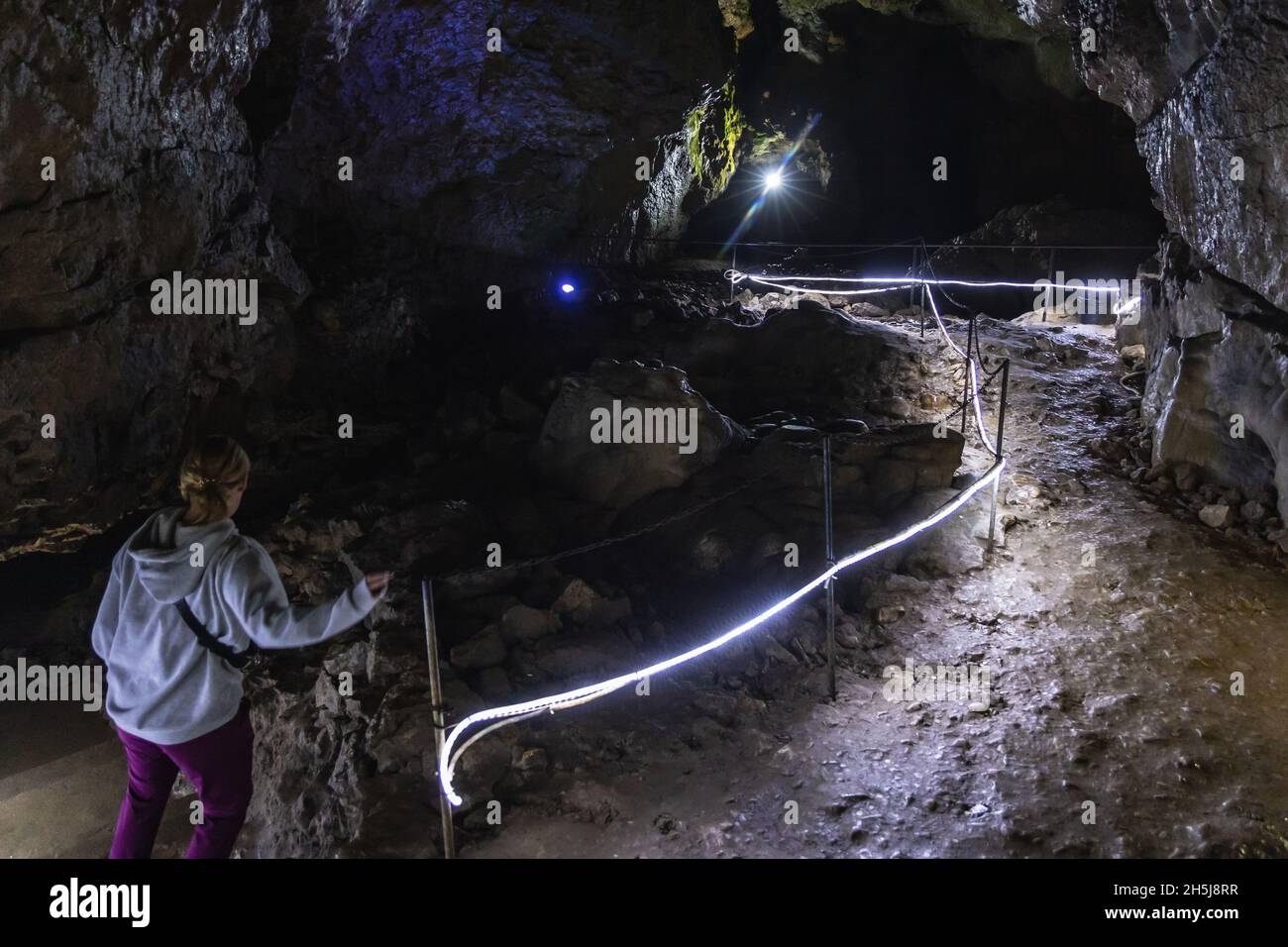 Tourist in Bacho Kiro cave, embedded in the canyons of the Andaka and ...
