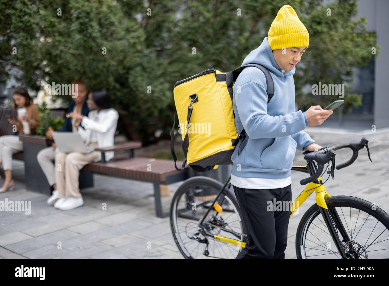 Delivery service in smartphone courier hi-res stock photography and ...