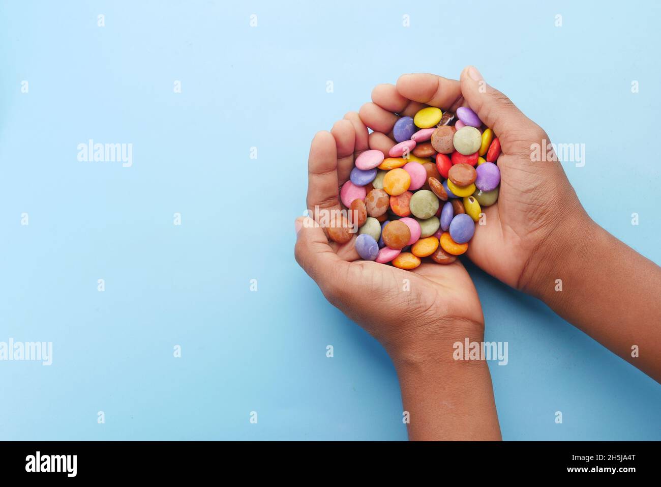 Child hand candies candy hi-res stock photography and images - Alamy