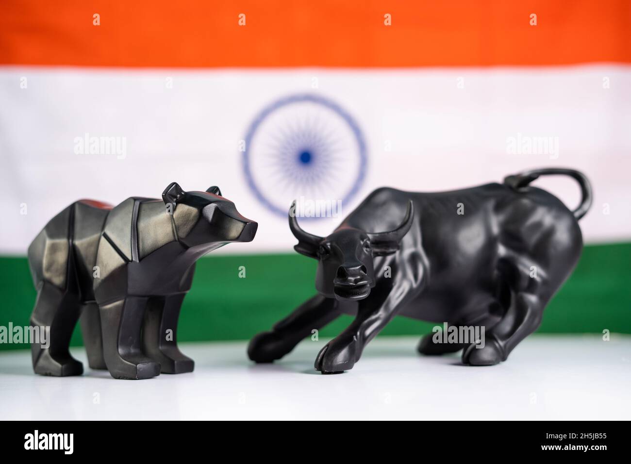 stock market bull and bear with Indian flag as background - Concept of ...