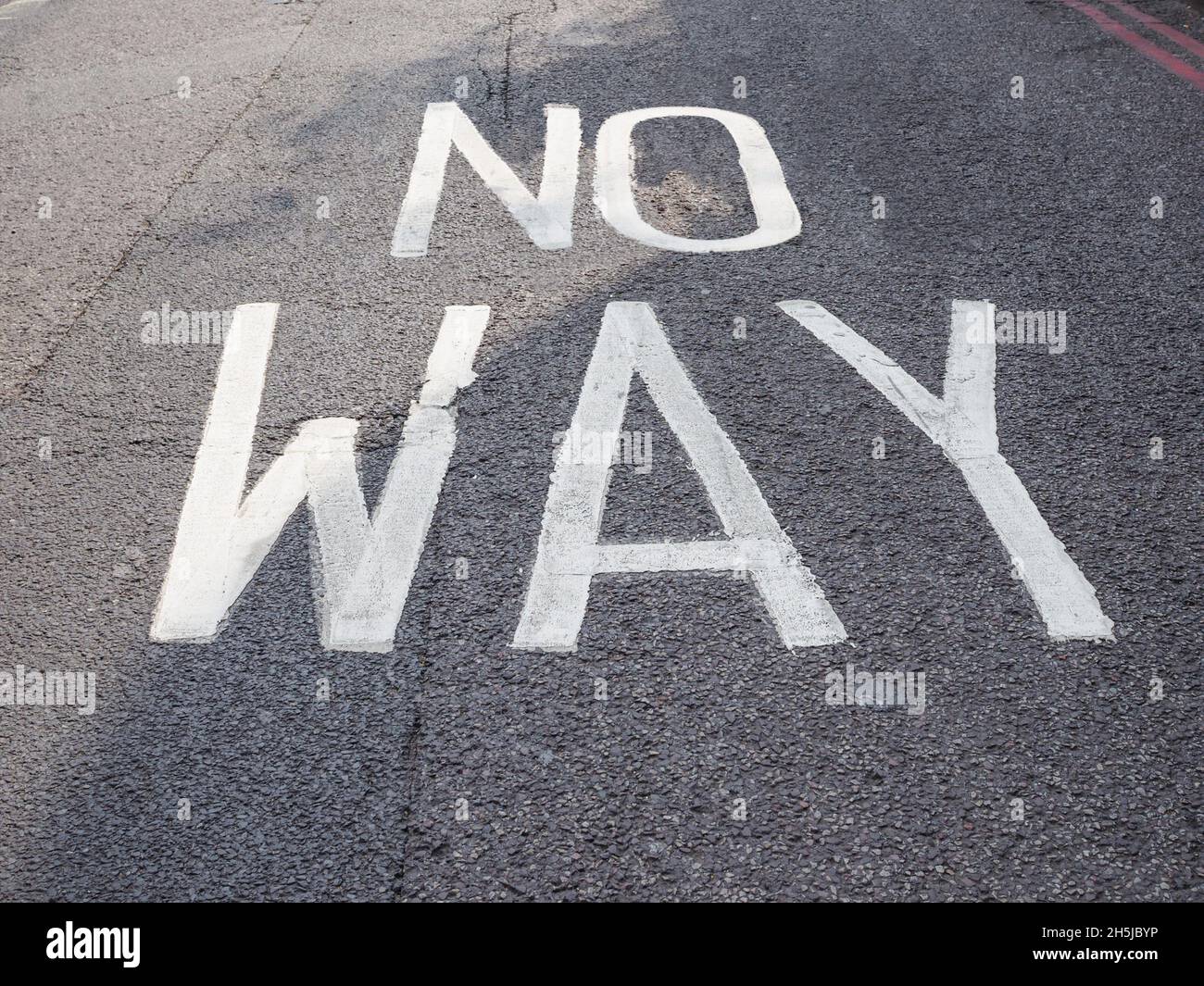 No way sign white paint on tarmac Stock Photo - Alamy