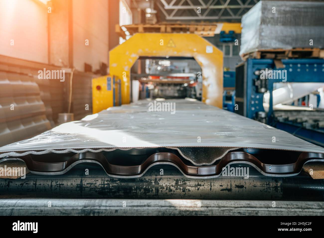 Conveyor belt or line with finished packaged metal roof tiles in ...