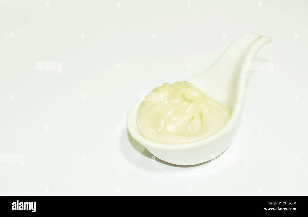 Xiuo Long Pao Chinese dumpling stuffed mashed pork and soup on spoon in ...