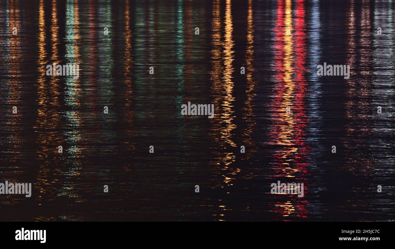 Night view of the smooth water surface of Burrard Inlet viewed from the ...