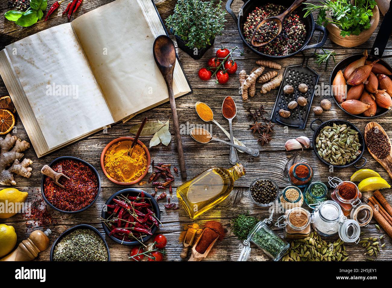 Cooking concepts: Top view of a rustic wood kitchen table filled with a ...