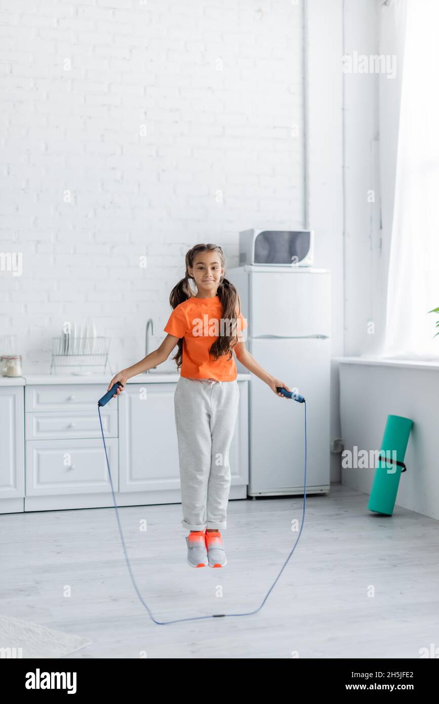Girl jumping rope at home hi-res stock photography and images - Alamy
