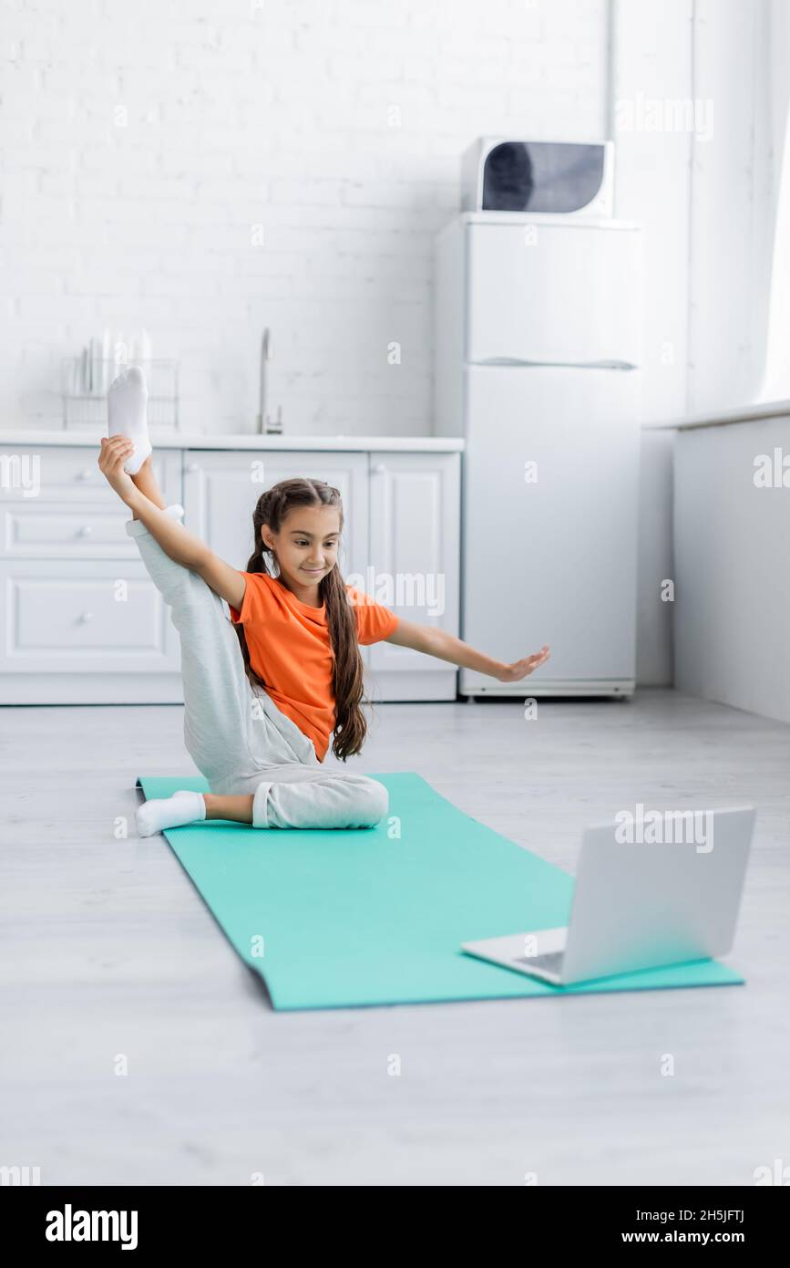 Kid stretching hi-res stock photography and images - Alamy