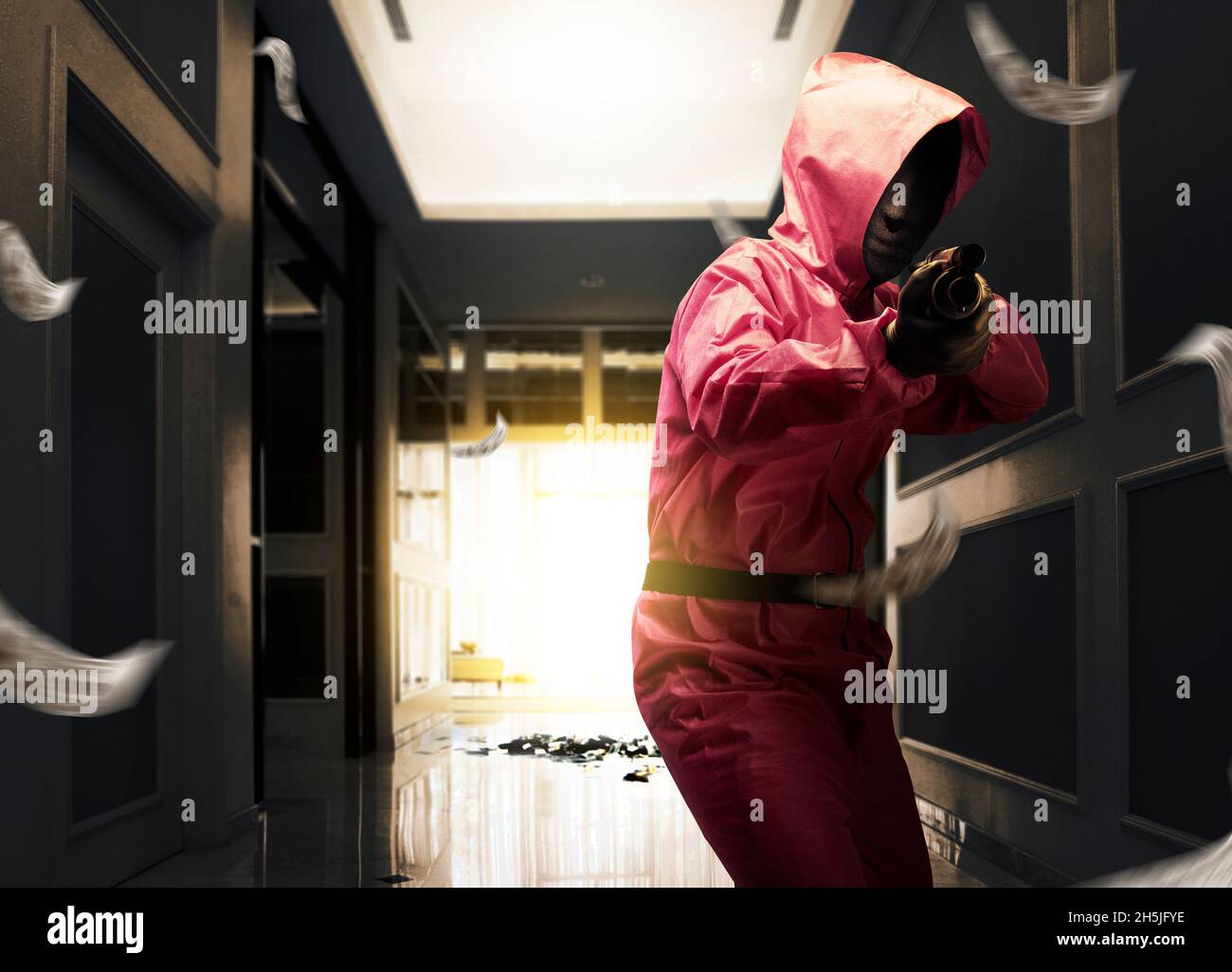 Criminal man in pink guard uniform pointing the shotgun while robbery ...