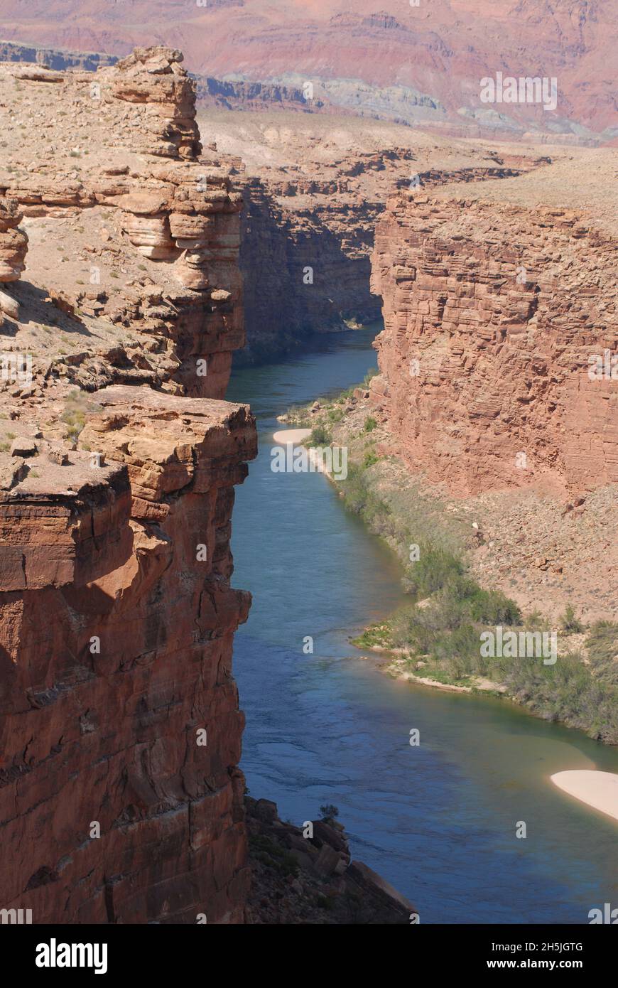 A panoramic vertical overview of the Colorado river with steep, high ...