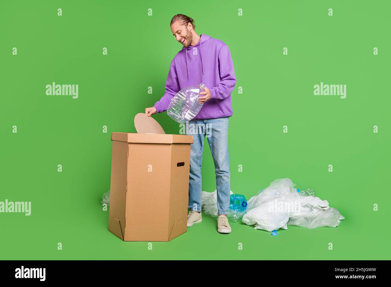 Photo of guy activist throw waste bin plastic bottle international ...