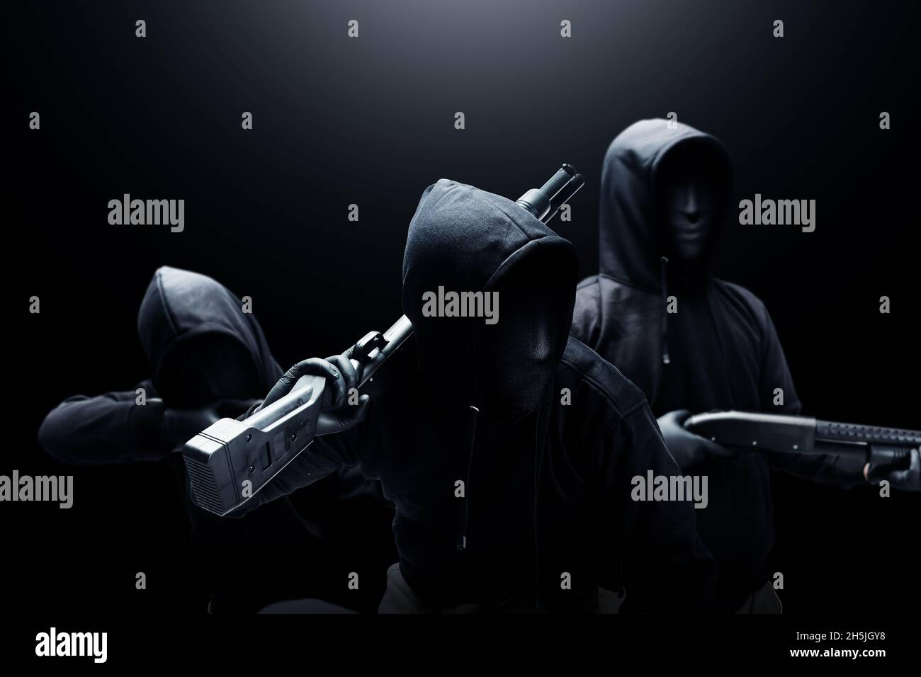 Group of criminal man in a hidden mask with a shotgun on black ...