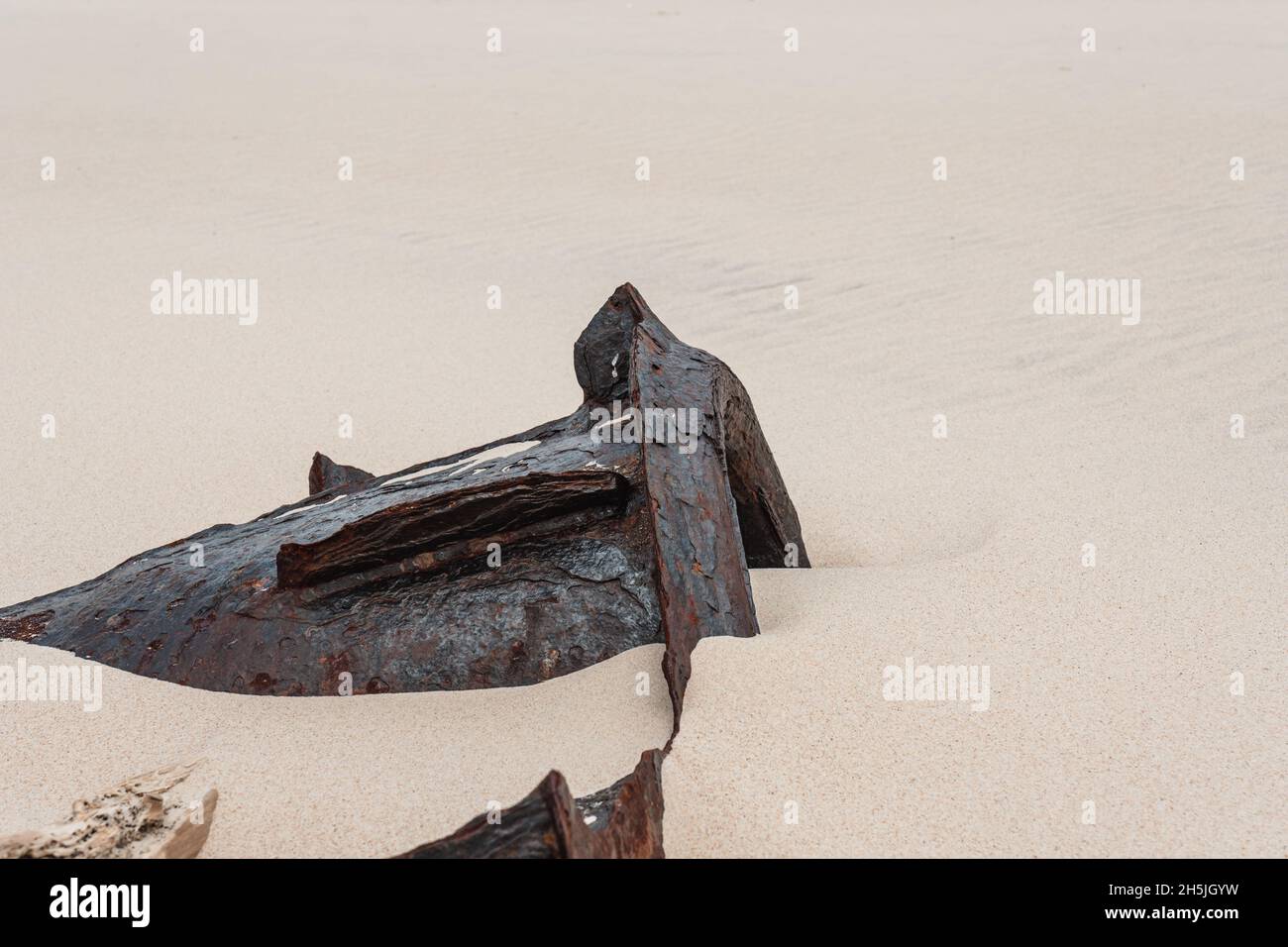 Rusted metal piece of a shipwreck on a beach near Juodkrante, Lithuania ...