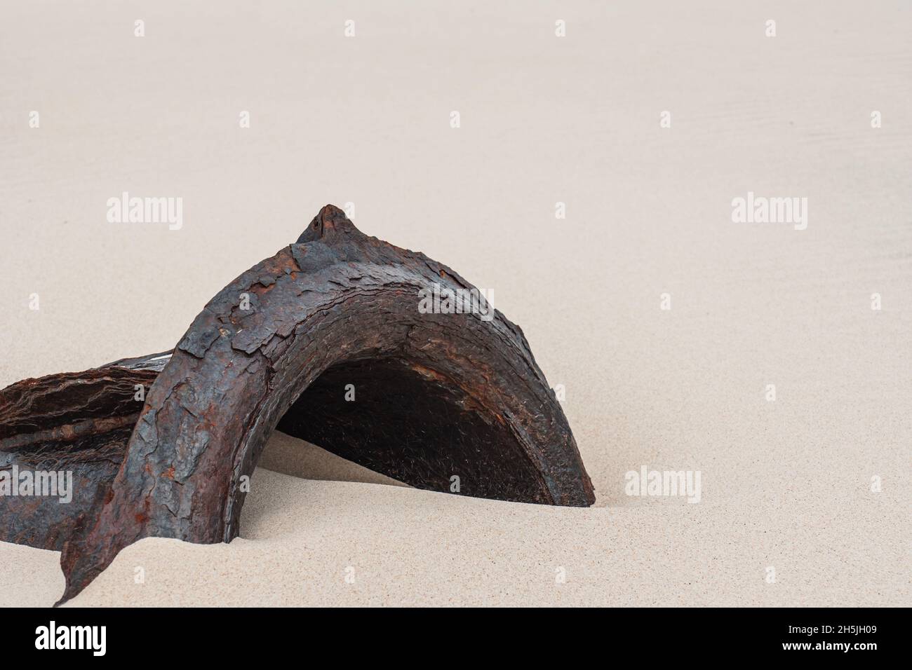 Rusted metal piece of a shipwreck on a beach near Juodkrante, Lithuania ...
