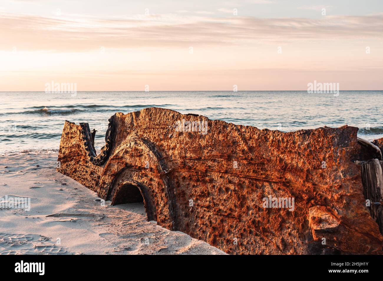 Rusted metal piece of a shipwreck on a beach near Juodkrante, Lithuania ...